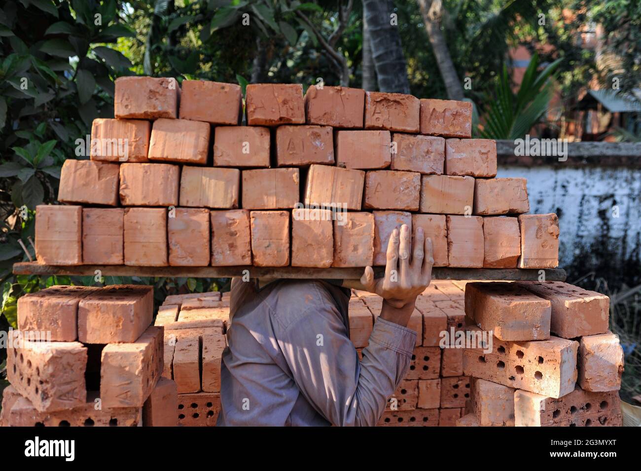 Construction worker carrying bricks hi-res stock photography and images ...