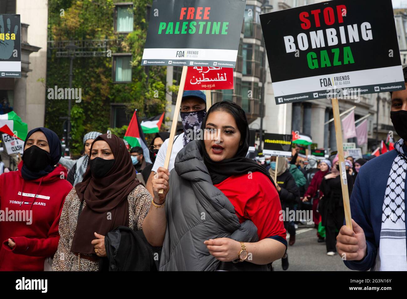 Women carrying signs at the Free Palestine Protest in London, UK 22.5. ...