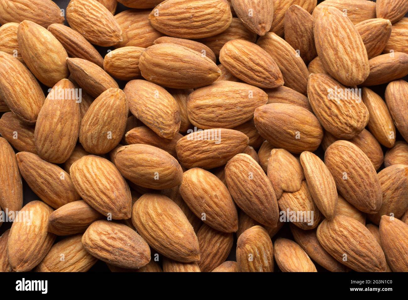 Overhead shot of raw almonds filling the frame Stock Photo - Alamy