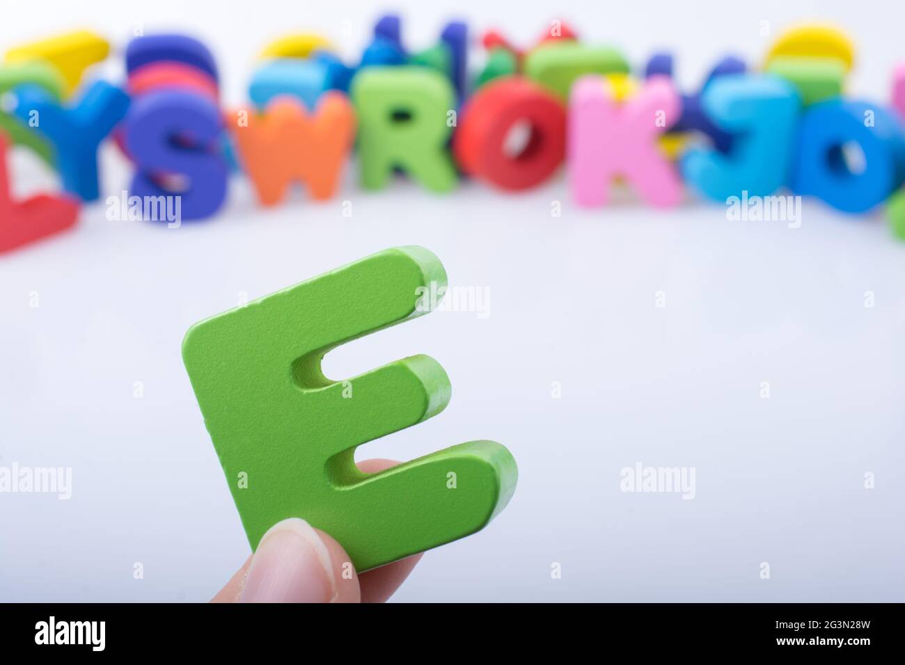 Letter cubes of e made of wood Stock Photo - Alamy