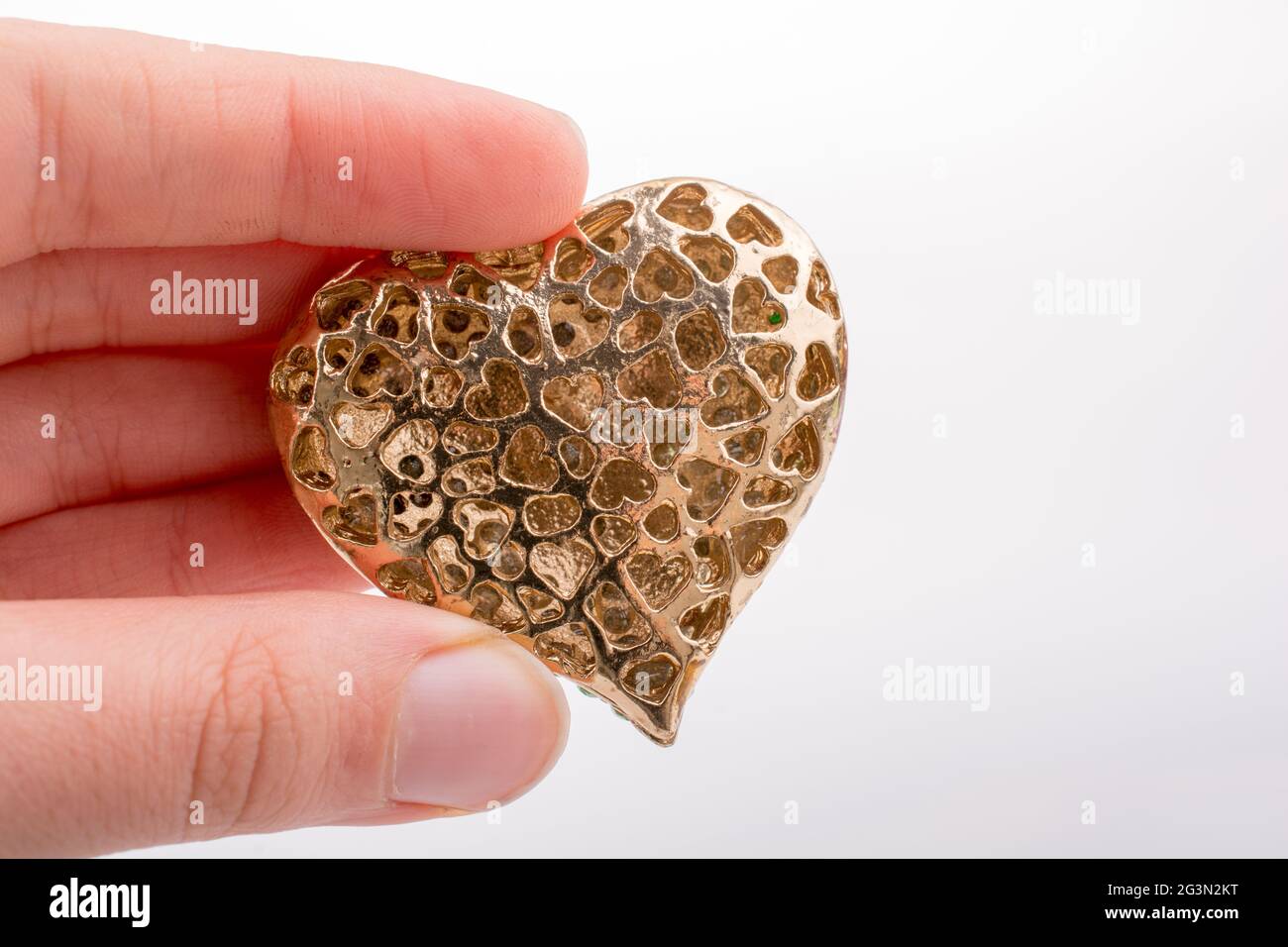 Hand gold heart hi-res stock photography and images - Alamy