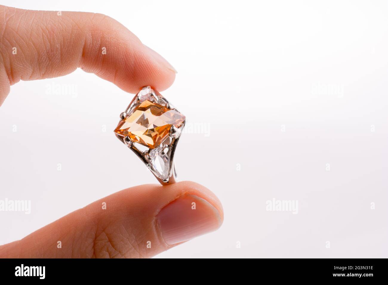 Hand holding ring Stock Photo - Alamy