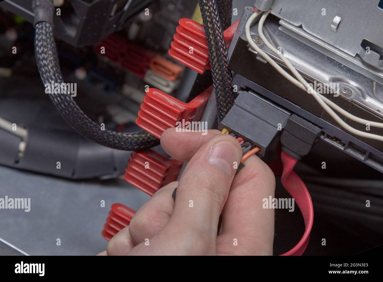 Connecting computer connectors, laying wires, cleaning dust Stock Photo ...