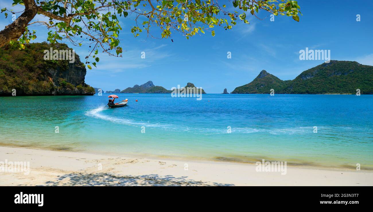 long tail boat, in white sand beach in the andaman sea Stock Photo - Alamy