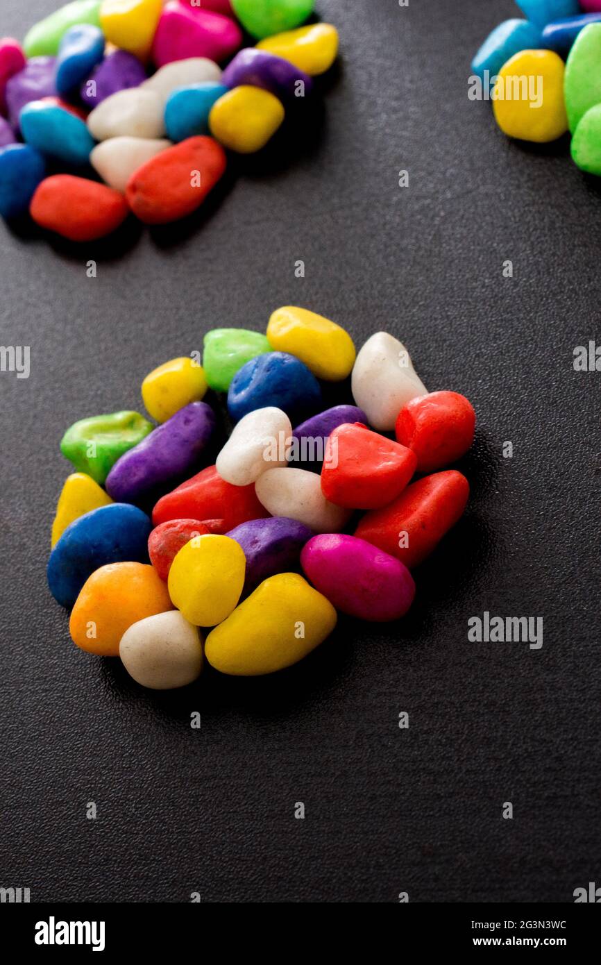Pile of colorful pebbles as a stone background Stock Photo - Alamy