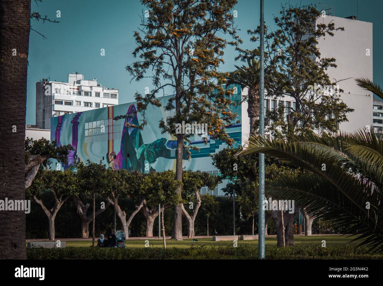 Large view of colorful drawings on the wall of a building in a public ...
