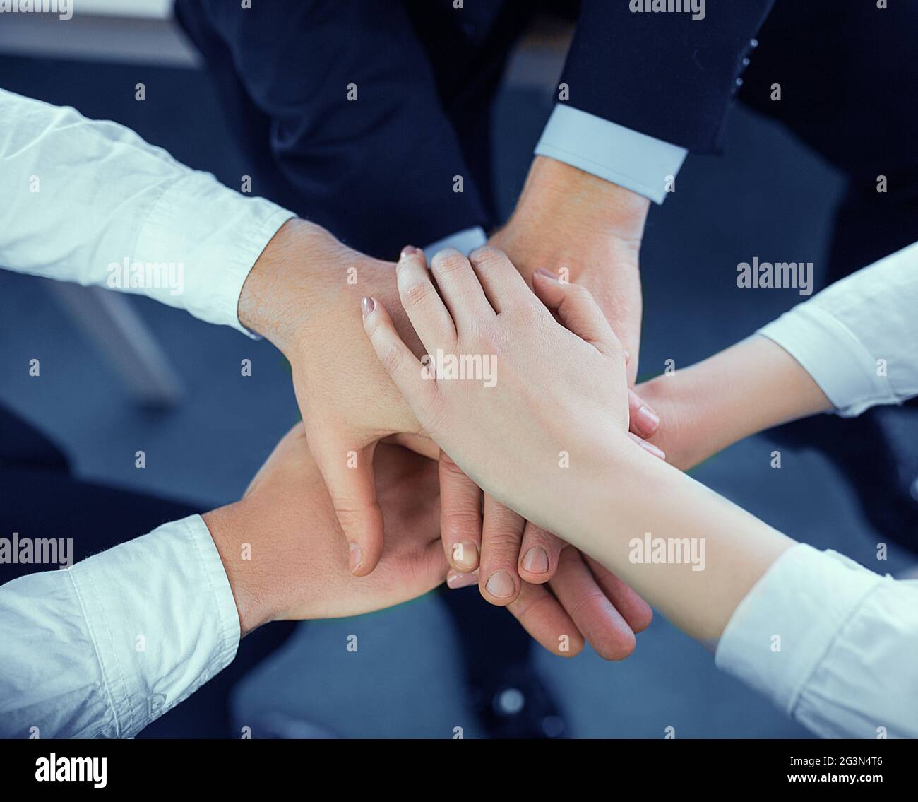 Hands folded together Stock Photo - Alamy