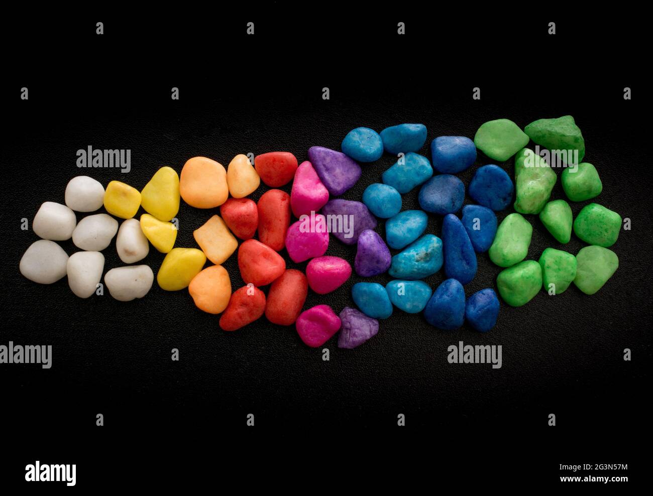 Pile of colorful pebbles as a stone background Stock Photo - Alamy
