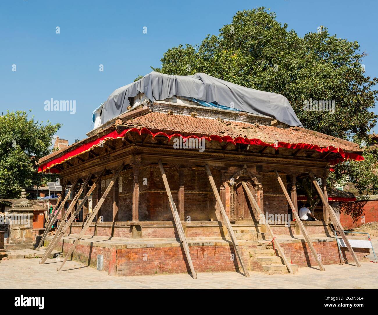 Temple supported by beams after powerful earthquake Stock Photo - Alamy