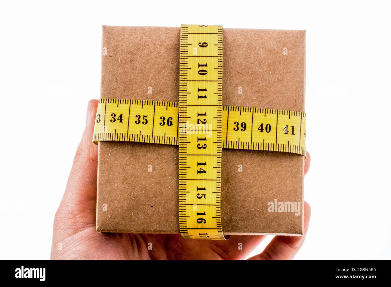 Gift box wrapped with tape measure Stock Photo - Alamy