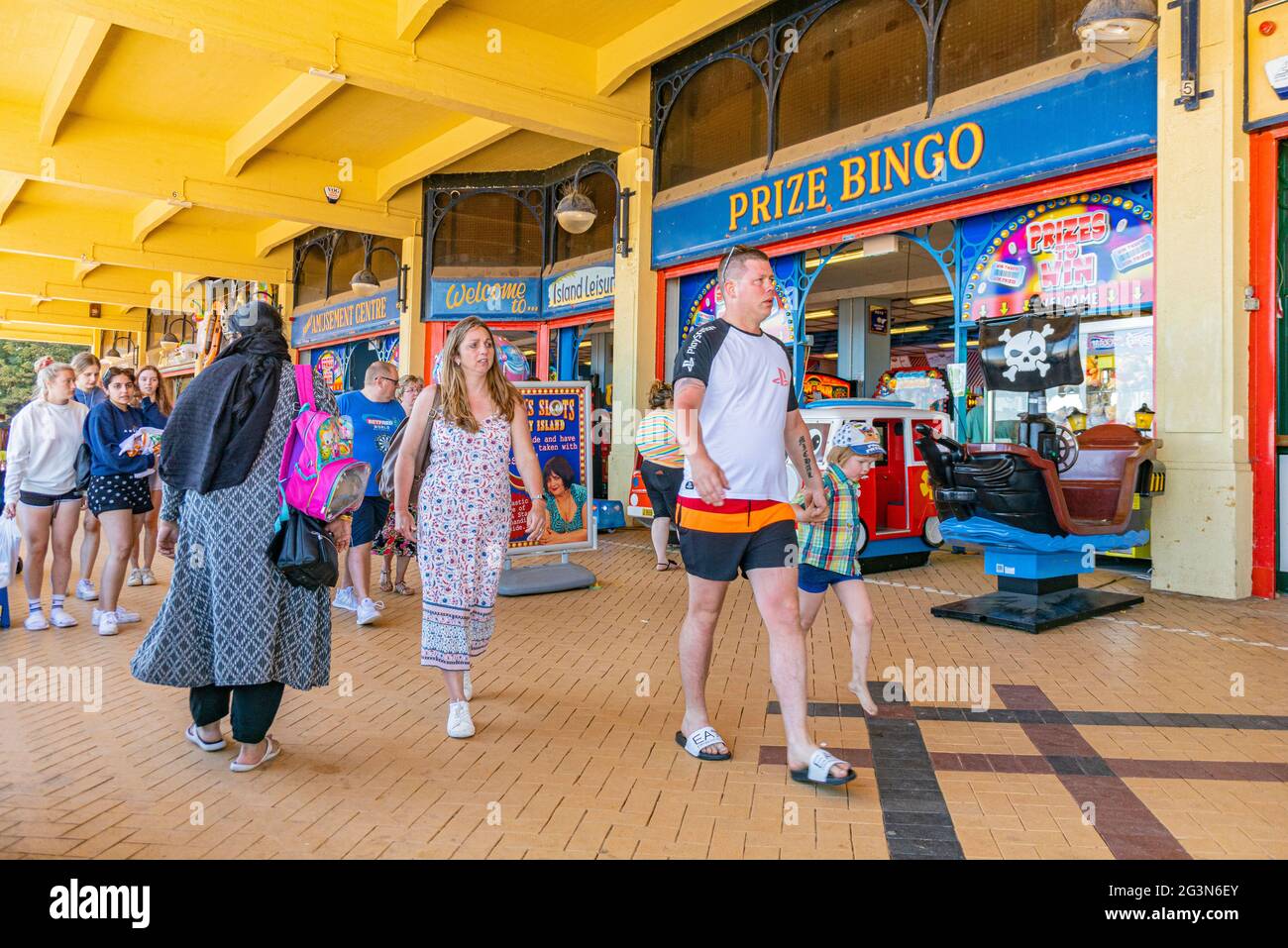 Families enjoying a day out a Barry Island Beach resort, South Wales ...