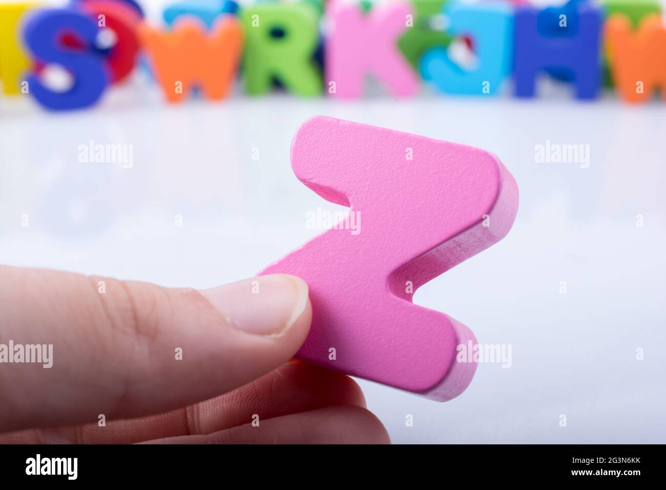 Hand holding Letter cube Z of Alphabet Stock Photo - Alamy
