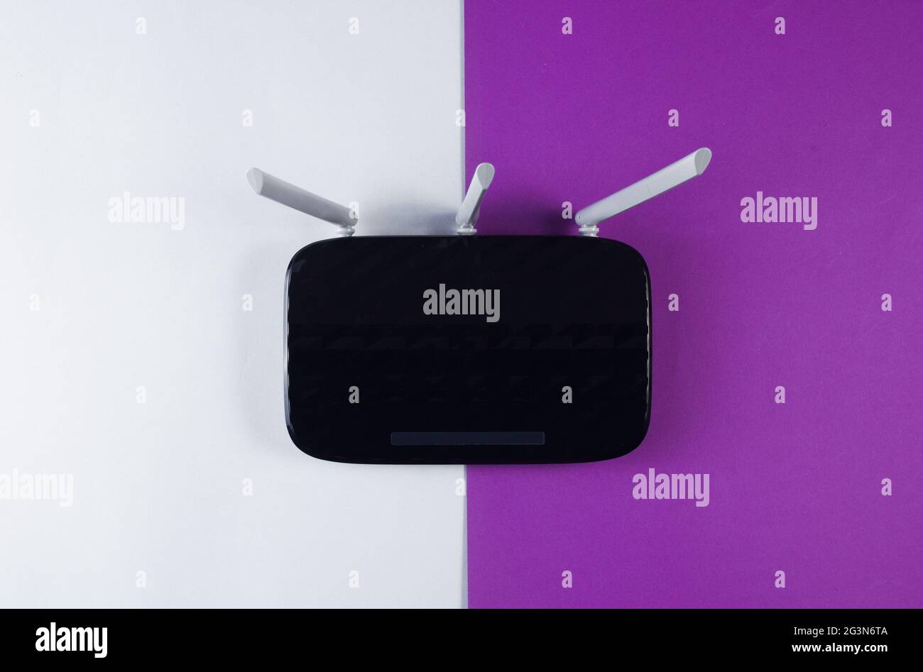 Tried Wi fi router on gray-purple background. Top view Stock Photo - Alamy