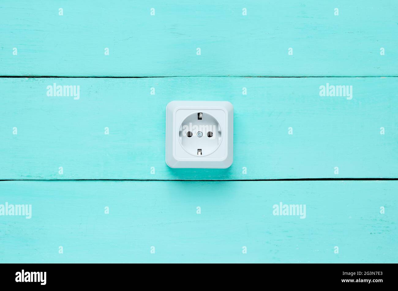 Power socket on blue wooden wall, minimalism Stock Photo - Alamy
