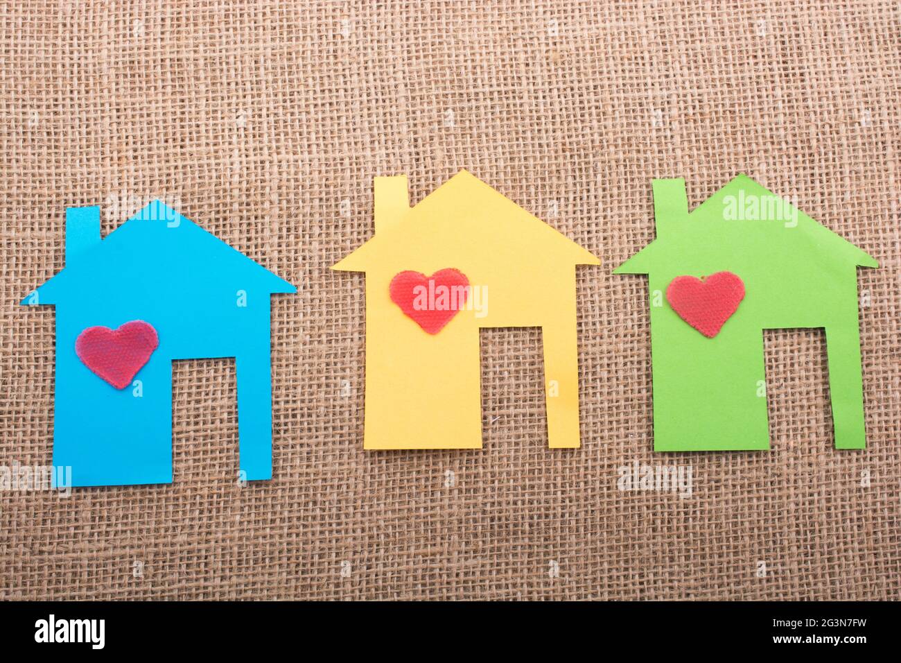 Heart shape on house shape cut out of paper Stock Photo - Alamy