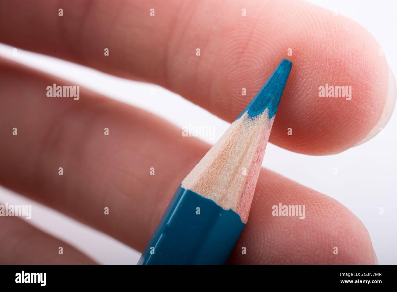 Hand holding pencil Stock Photo - Alamy