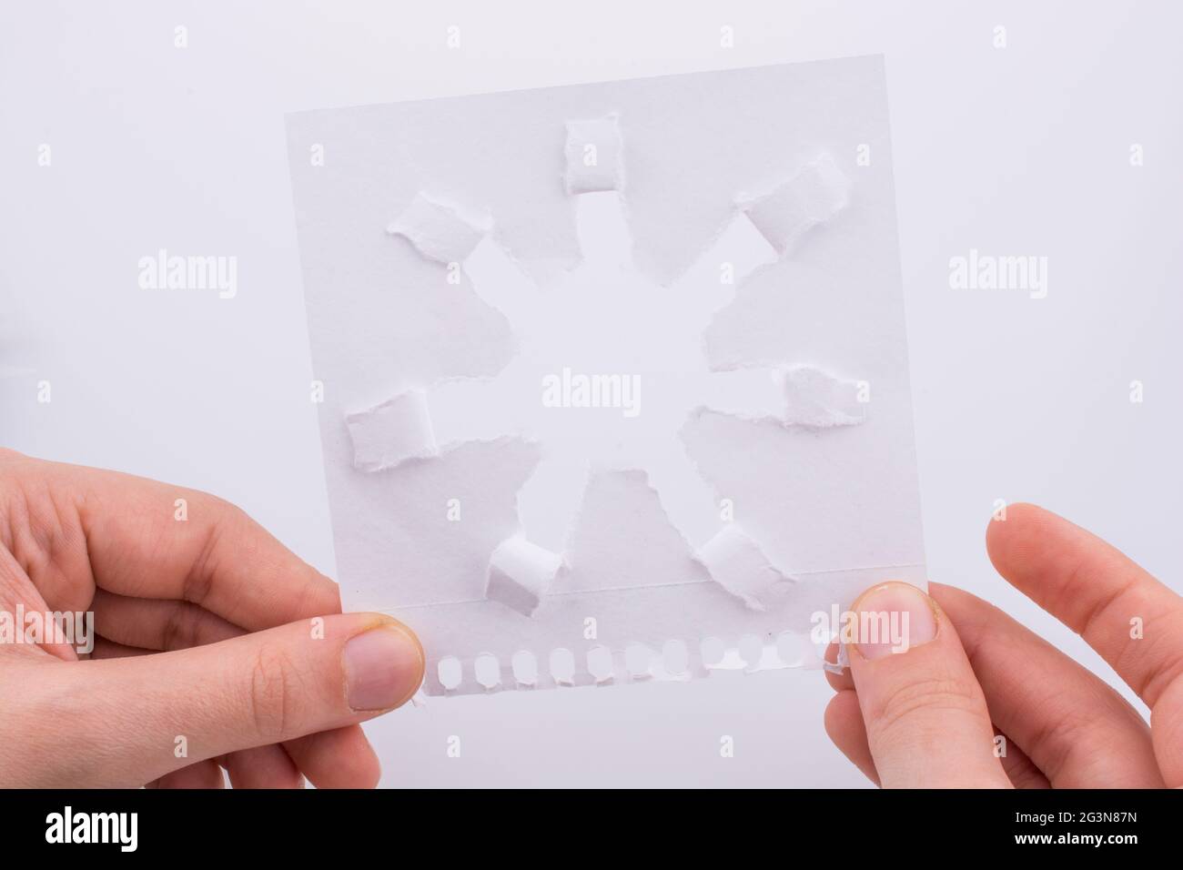 Hand holding paper art Stock Photo - Alamy