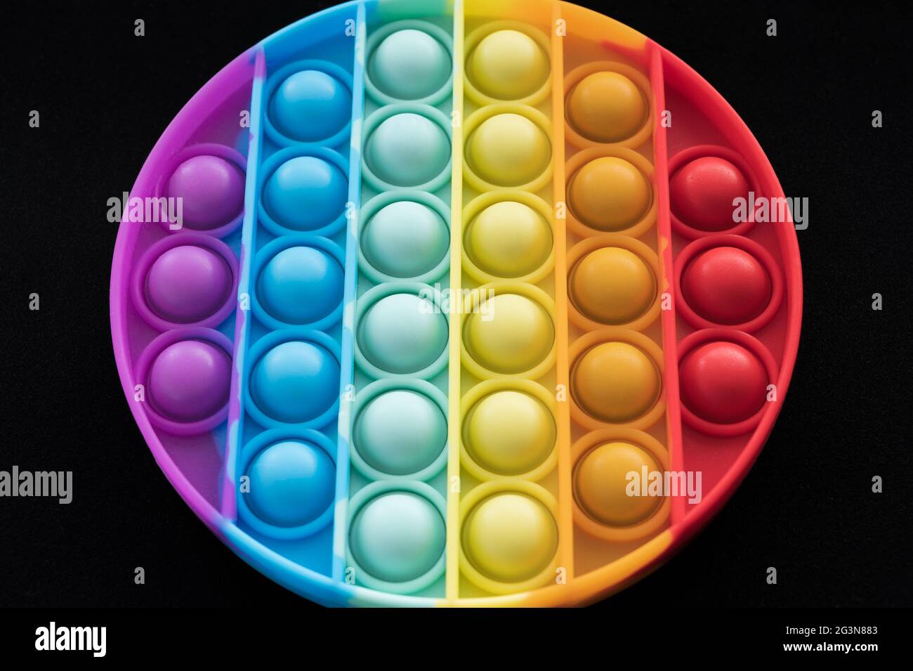 Colorful Pop It Fidget Toy On Dark Background Stock Photo - Alamy