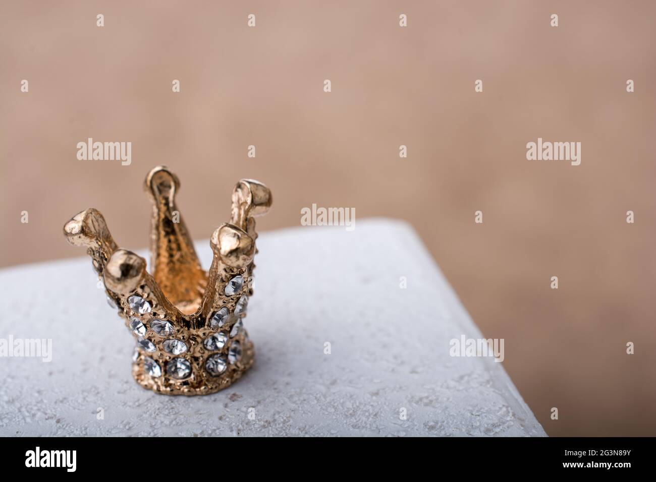 Model crown with and a thread knot Stock Photo - Alamy