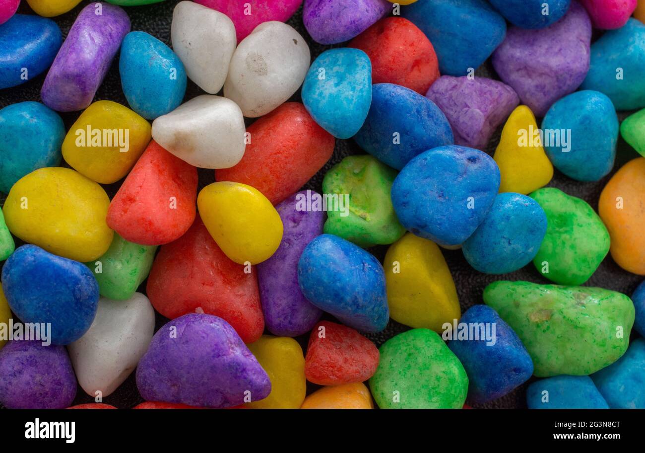 Pile of colorful pebbles as a stone background Stock Photo - Alamy