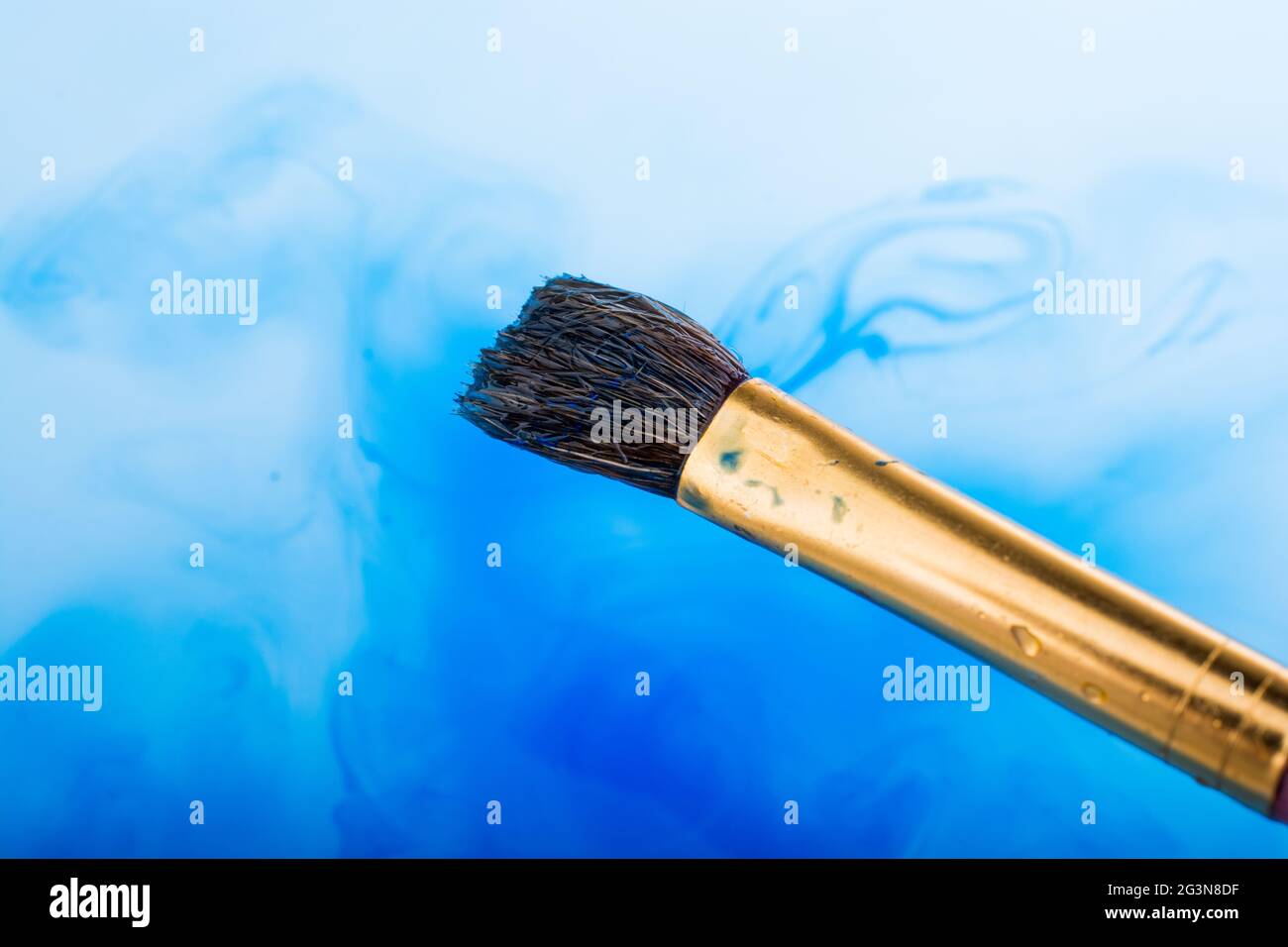 Watercolor paint dissolving in water Stock Photo - Alamy