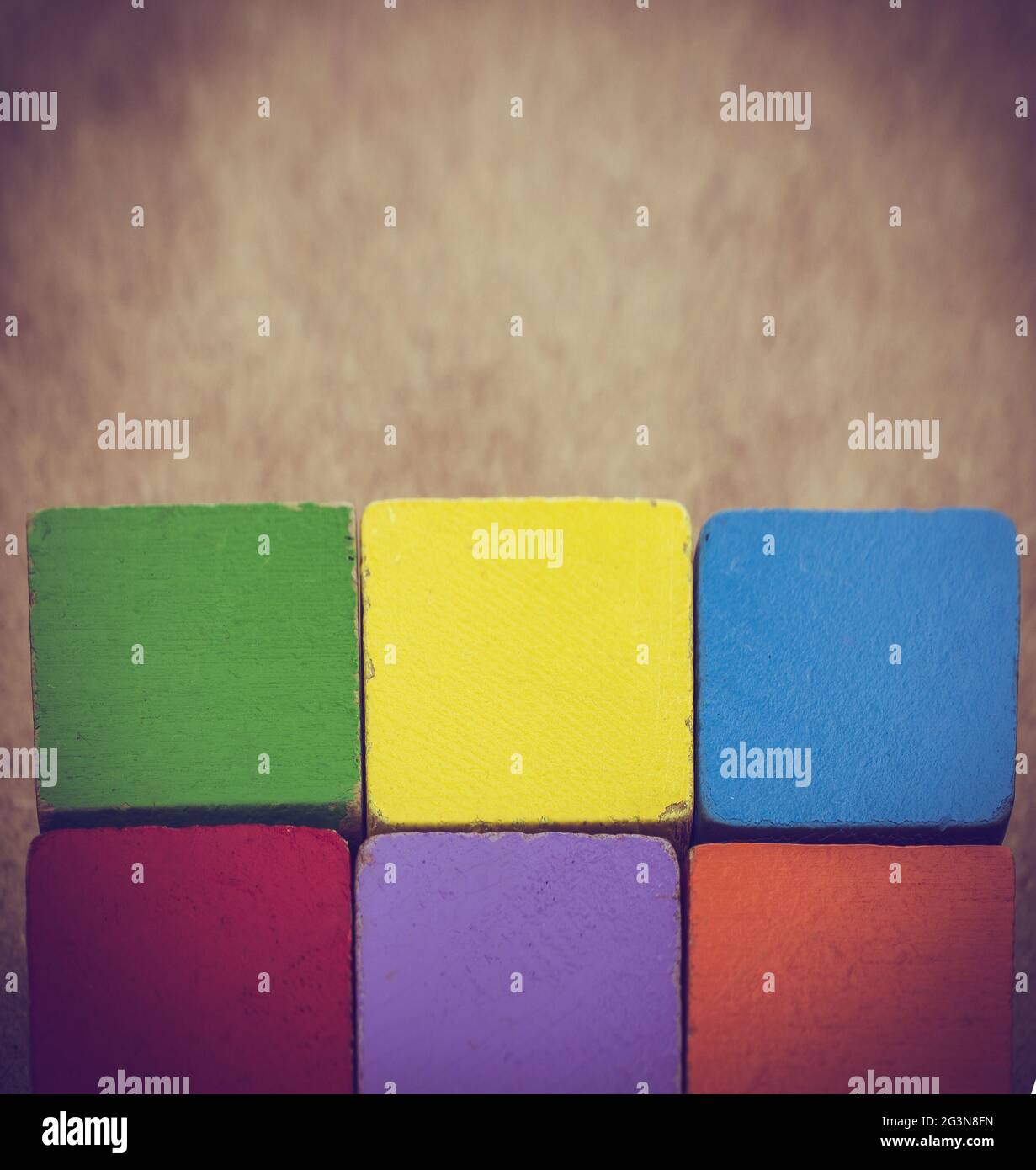 Colorful building blocks on brown background Stock Photo - Alamy