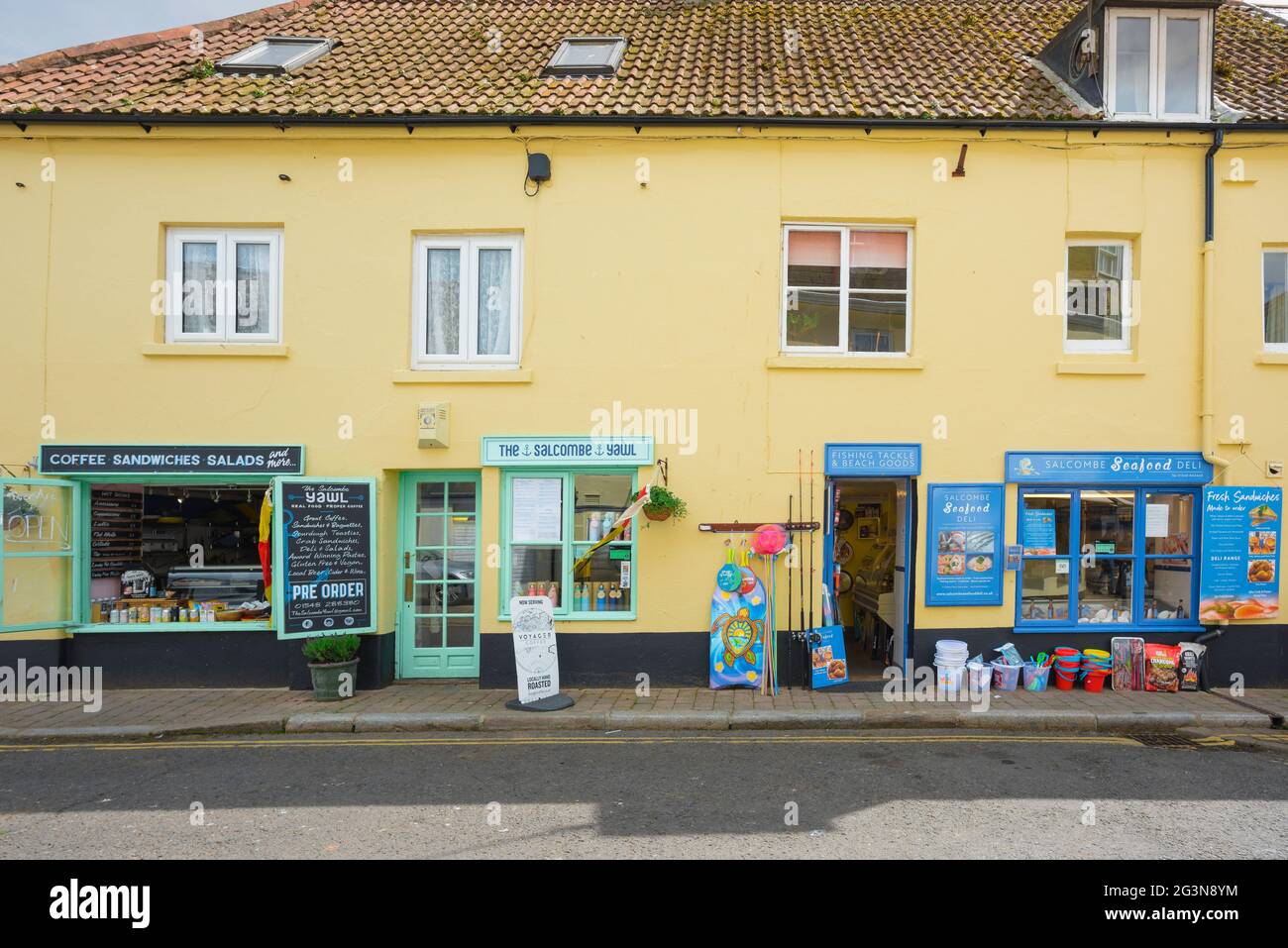 Salcombe shop, view in summer of a row of colourful shops in the centre ...
