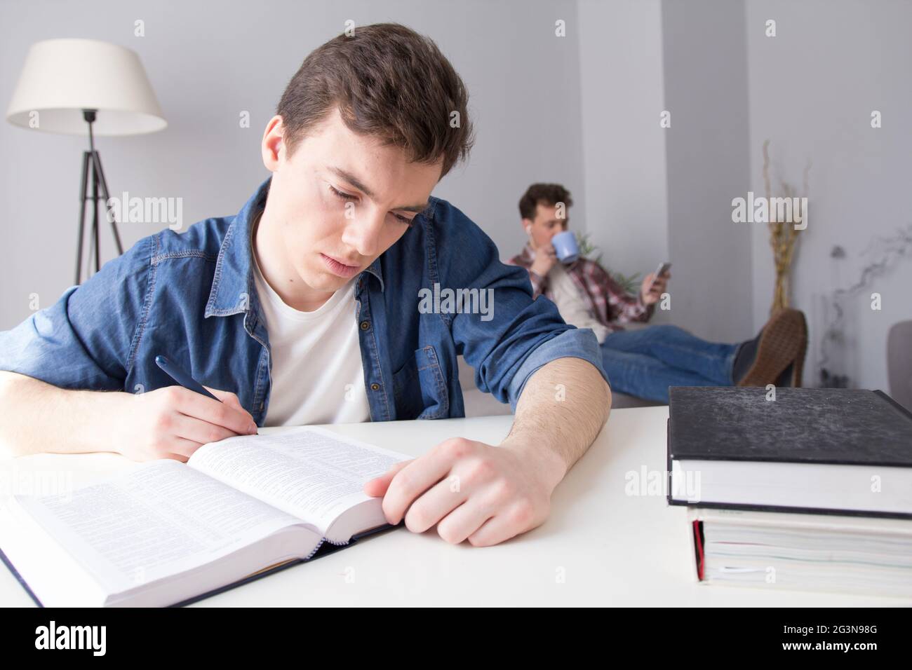 Happy guy studying hi-res stock photography and images - Alamy