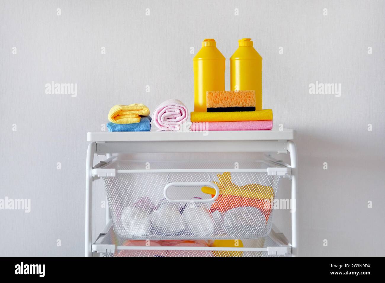 Detergent for cleaning room. Cleaning concept. Yellow plastic bottles ...