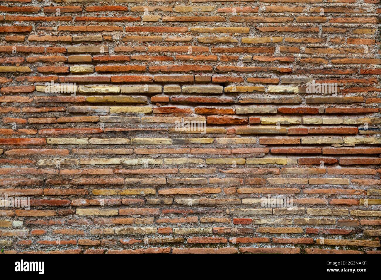 Ancient brickwork of flat roman bricks, Italy. May be used as ...