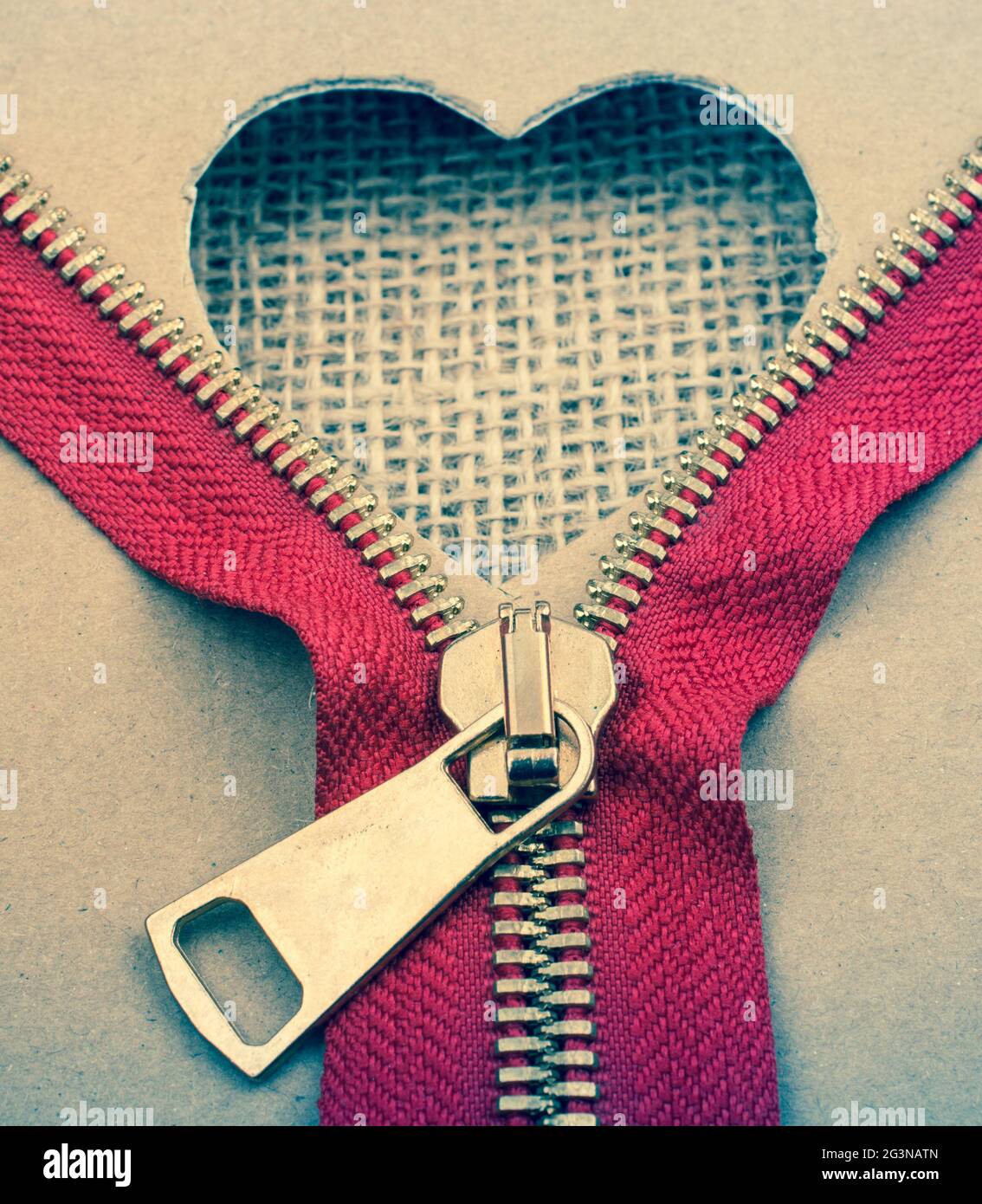 Zipper and heart shape hole on paper Stock Photo - Alamy