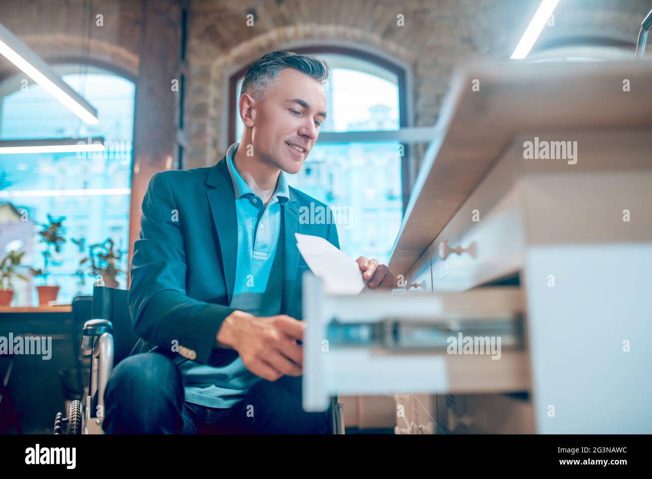Man working desk papers hi-res stock photography and images - Alamy