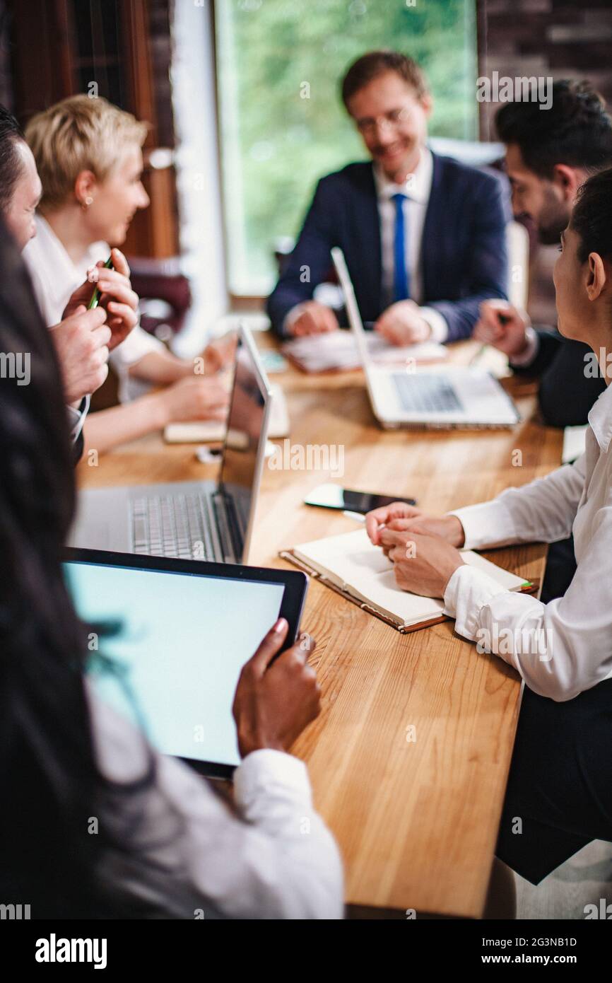 Business partners are negotiating in a conference room Stock Photo - Alamy