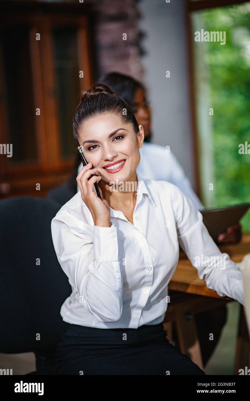 Young business woman in the office at the negotiations Stock Photo - Alamy