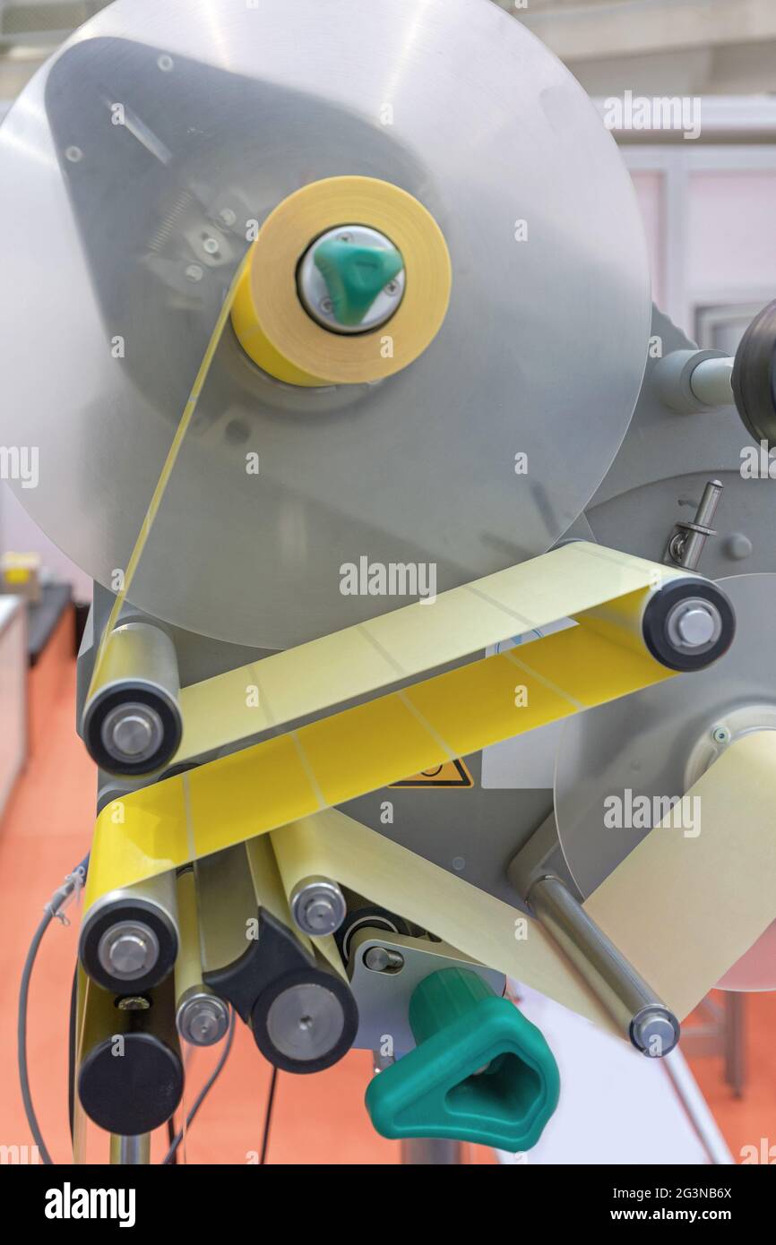 Automated Labeler Machine at Packing Line Factory Stock Photo - Alamy