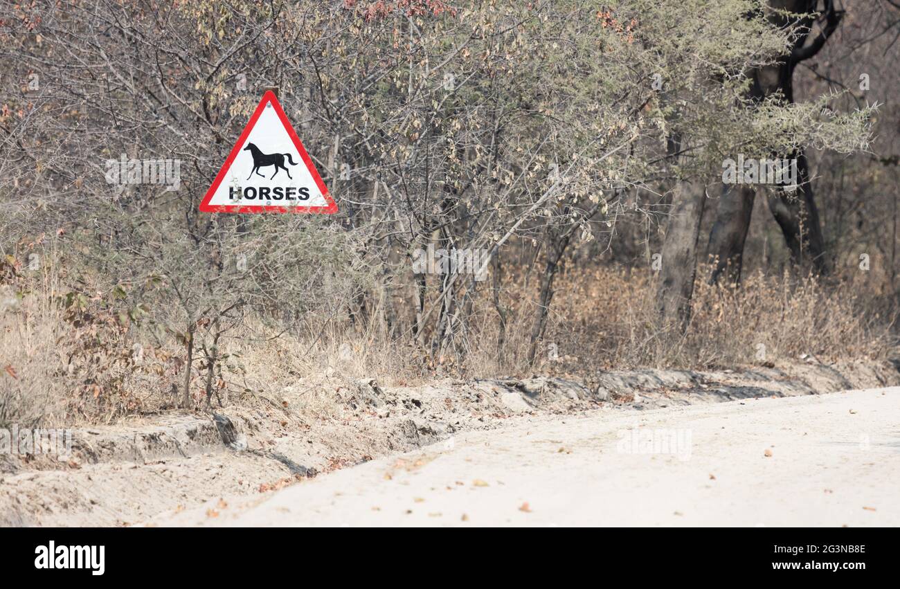 Sign at the side of the road, warning for horses Stock Photo - Alamy
