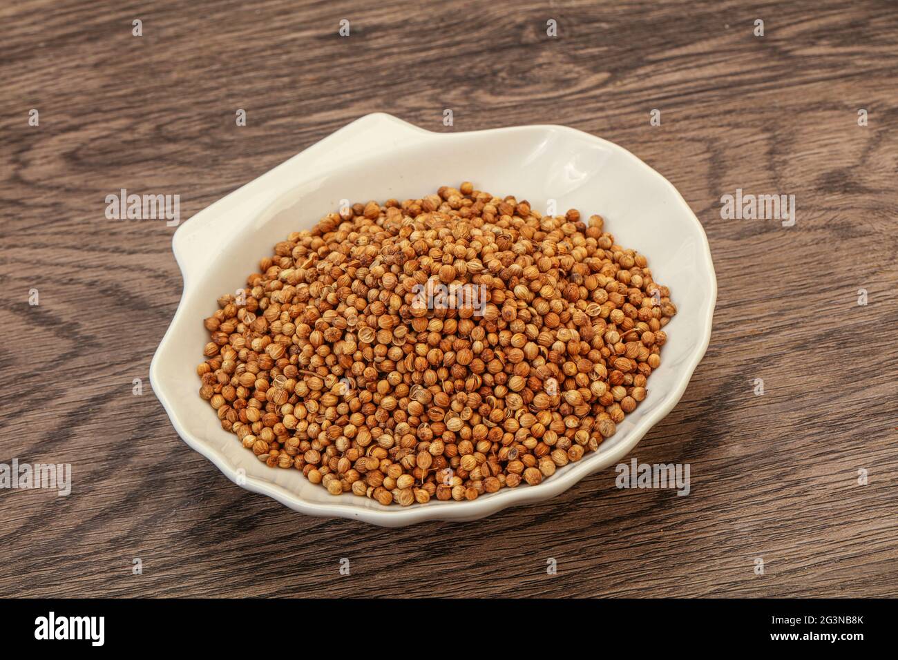 Dry Coriander seeds in the bowl Stock Photo - Alamy