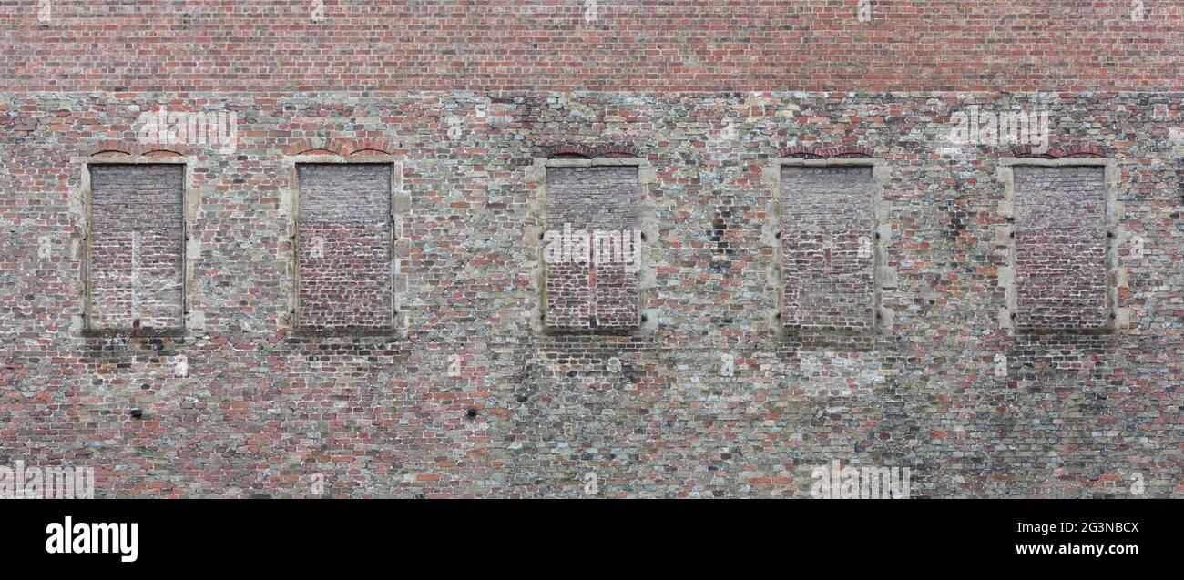 Brick wall with windows bricked over Stock Photo - Alamy