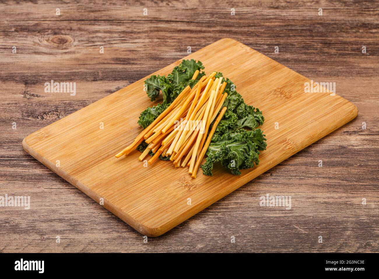 Caucasian Chechel cheese sticks over board Stock Photo - Alamy