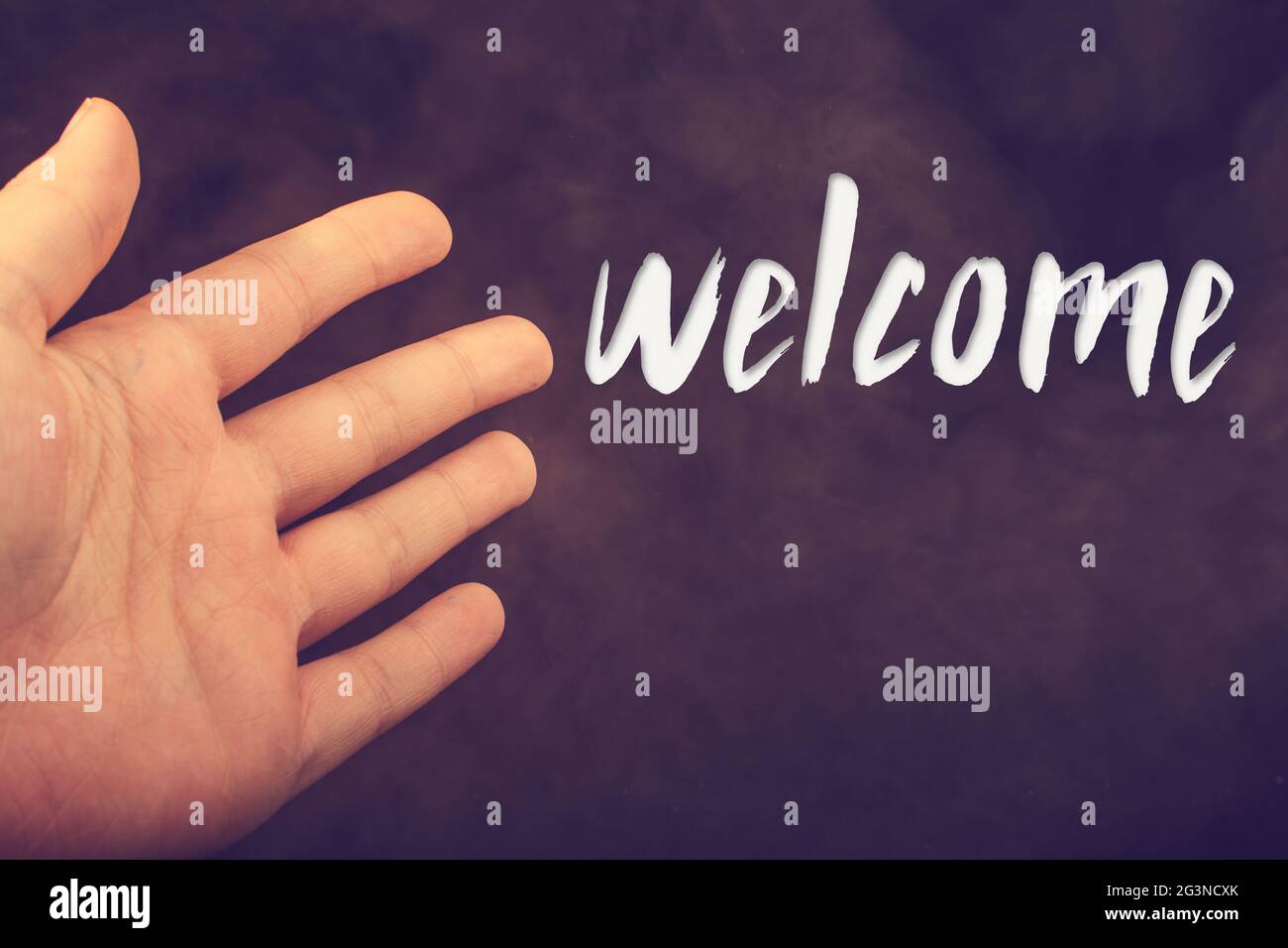 Hand making a welcome gesture Stock Photo - Alamy