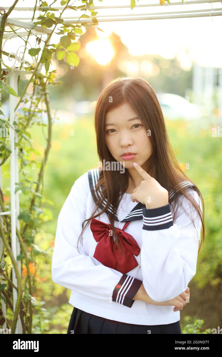 school girl costume at park outdoor with flowers garden background ...
