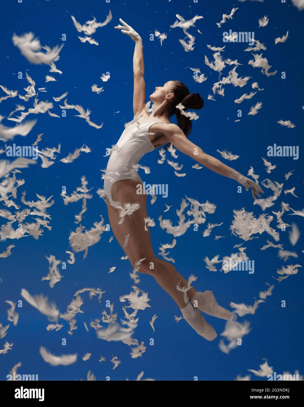 Graceful young beautiful girl, female ballet dancer flying isolated ...