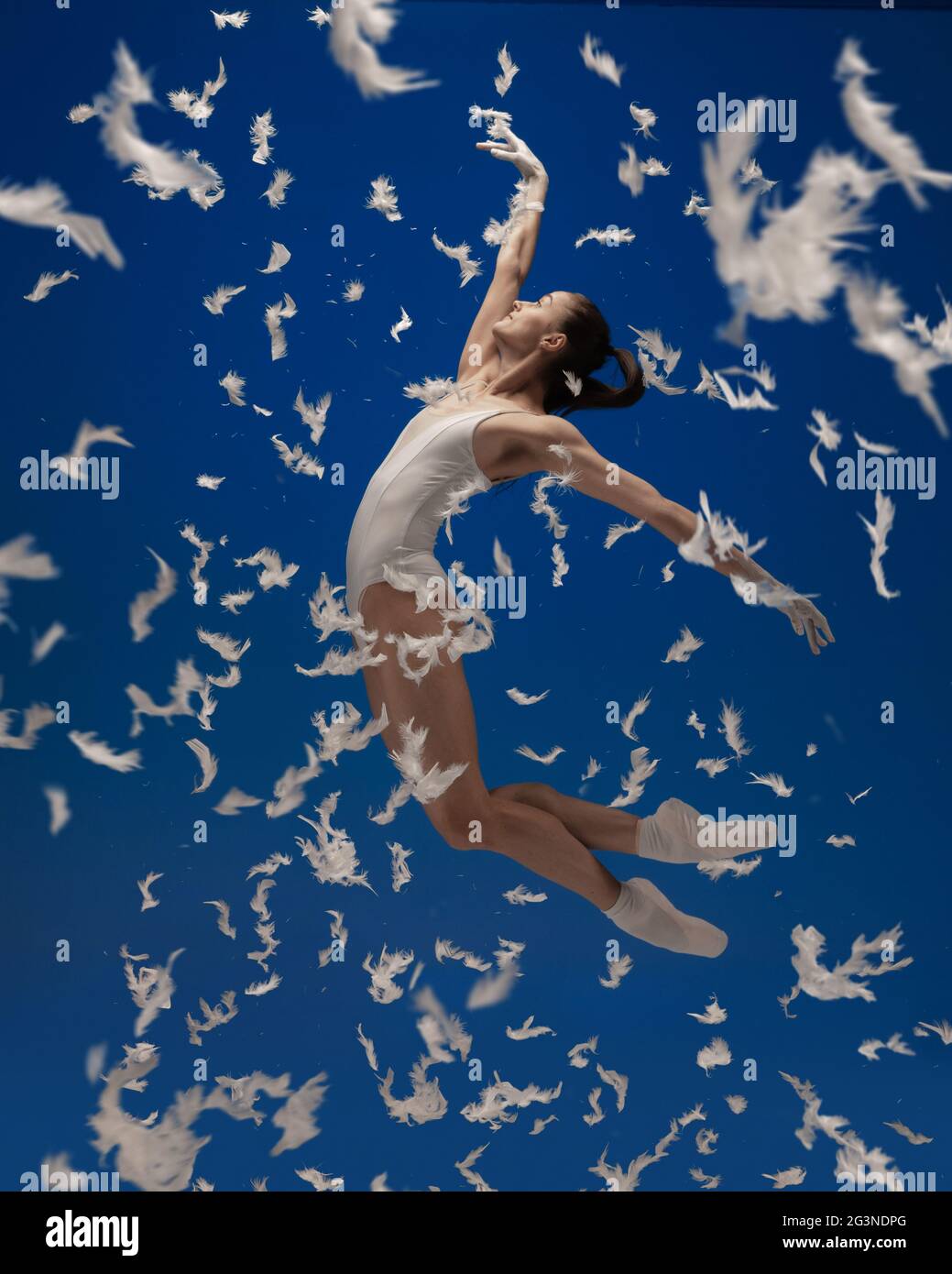 Graceful young beautiful girl, female ballet dancer flying isolated ...