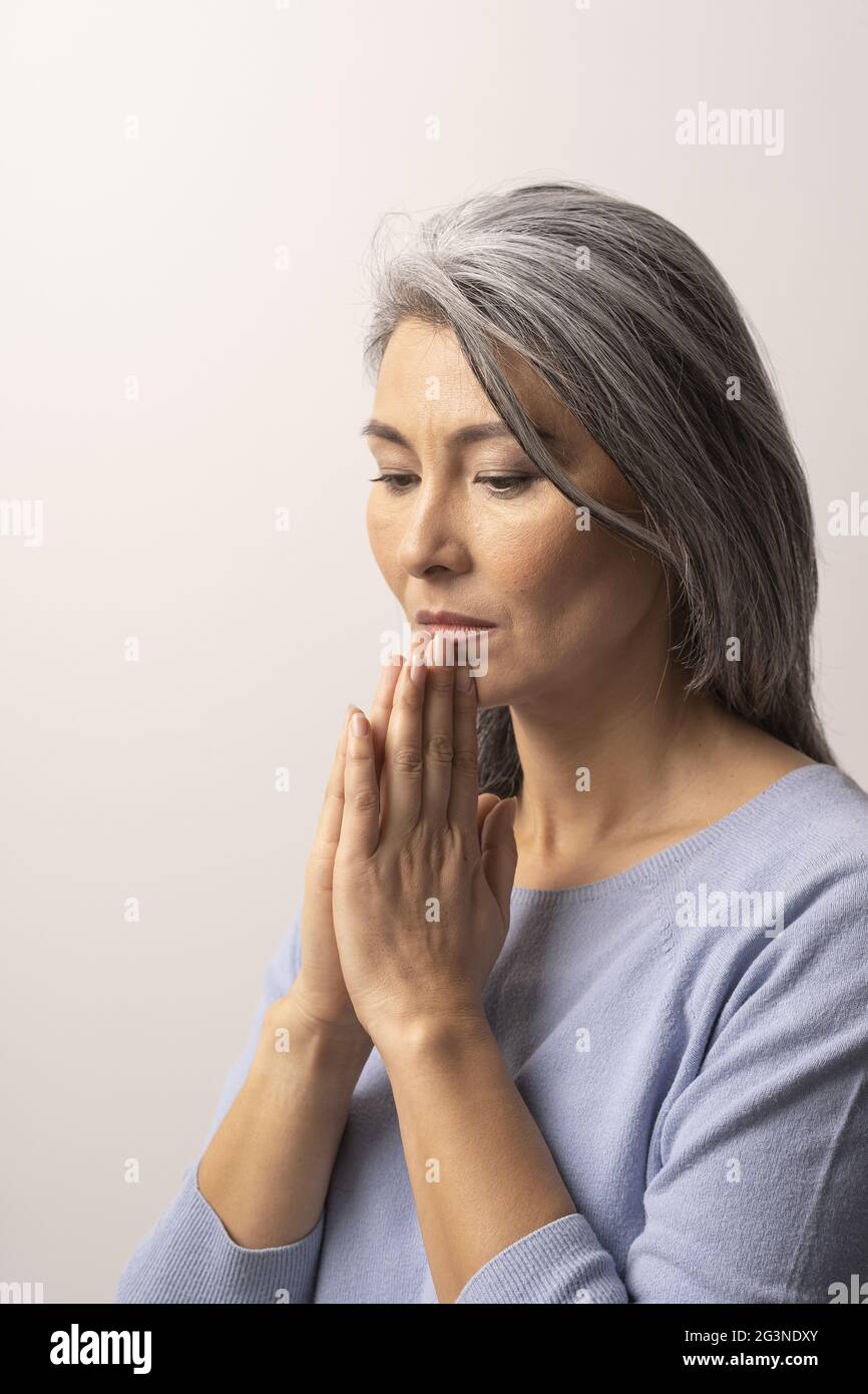 Pensive Mongolian Female Appearance on a White Background Stock Photo ...