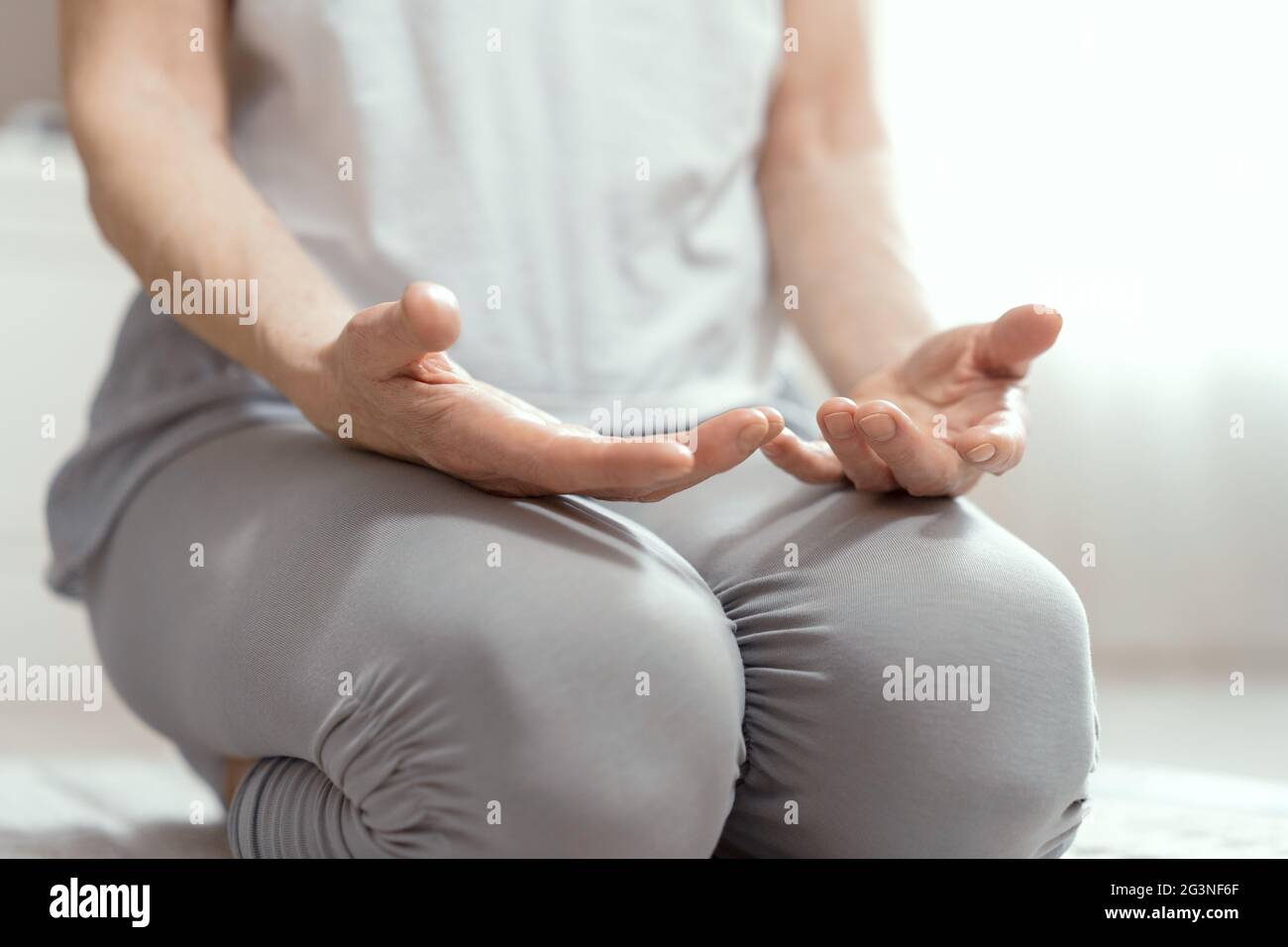 European Looking Woman Over 50 Years Old Doing Yoga at Home in the ...