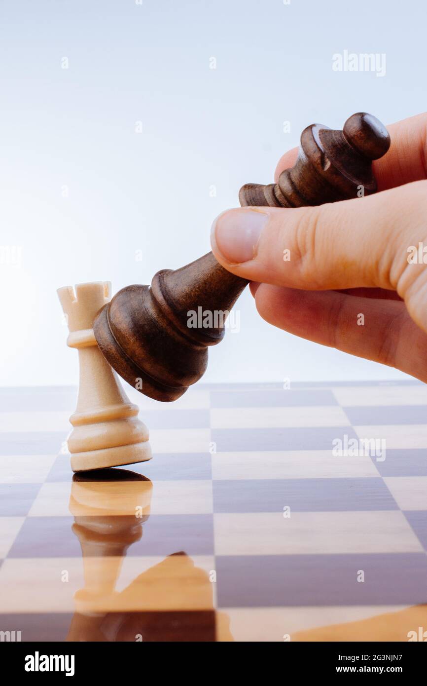 Person playing chess game making a move Stock Photo - Alamy