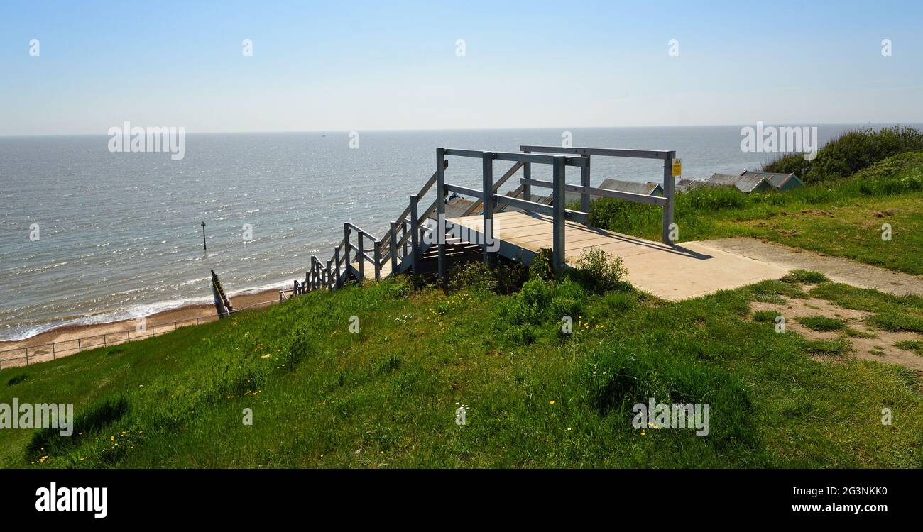 Wooden steps leading down to the sea , steps , beach huts, beach and ...