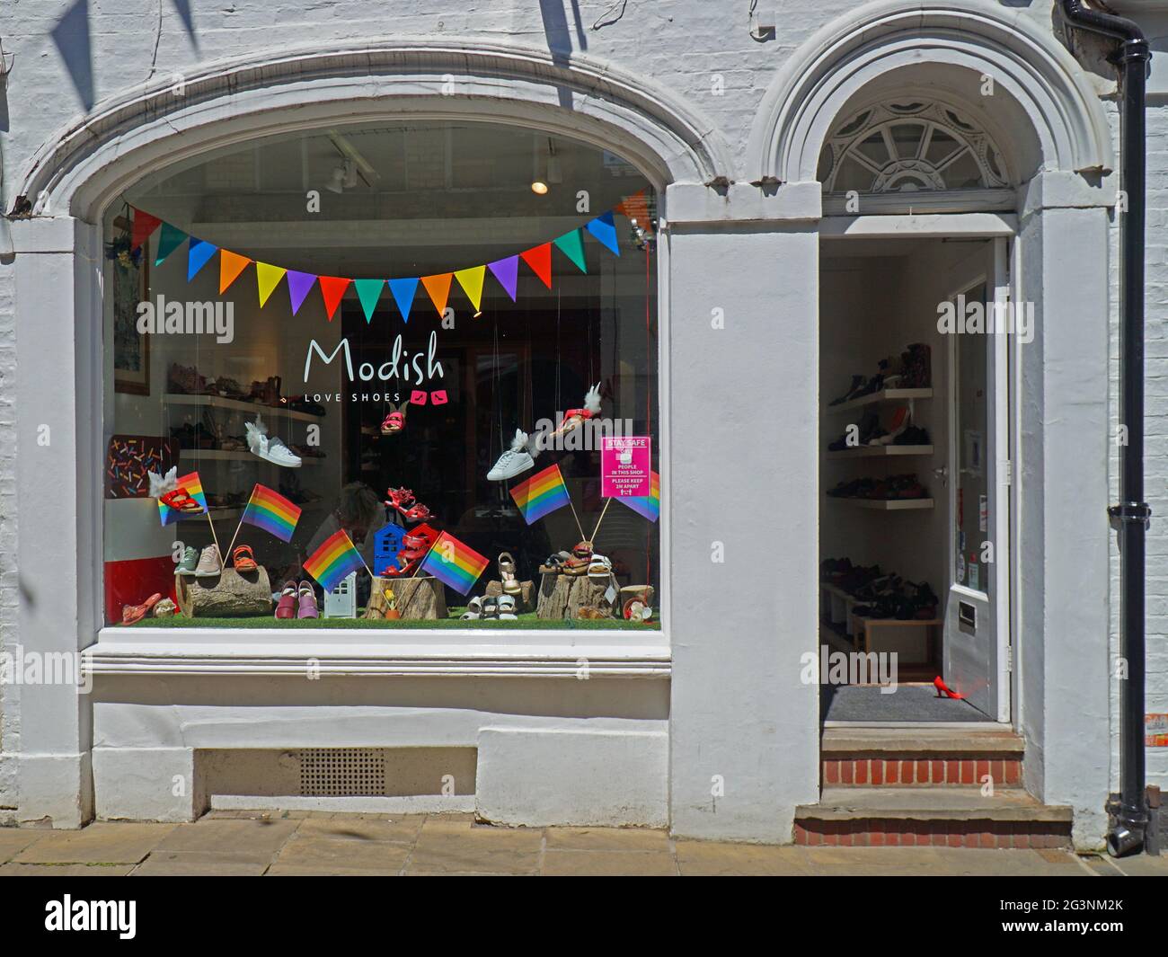 Modish Shoes shop frontage with gay pride flags and bunting Stock Photo ...