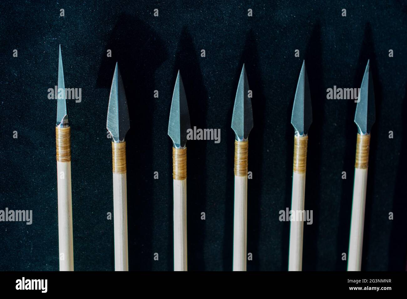 Old style old wooden arrows Stock Photo - Alamy