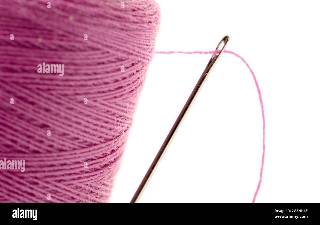 Sewing thread with needle Stock Photo - Alamy